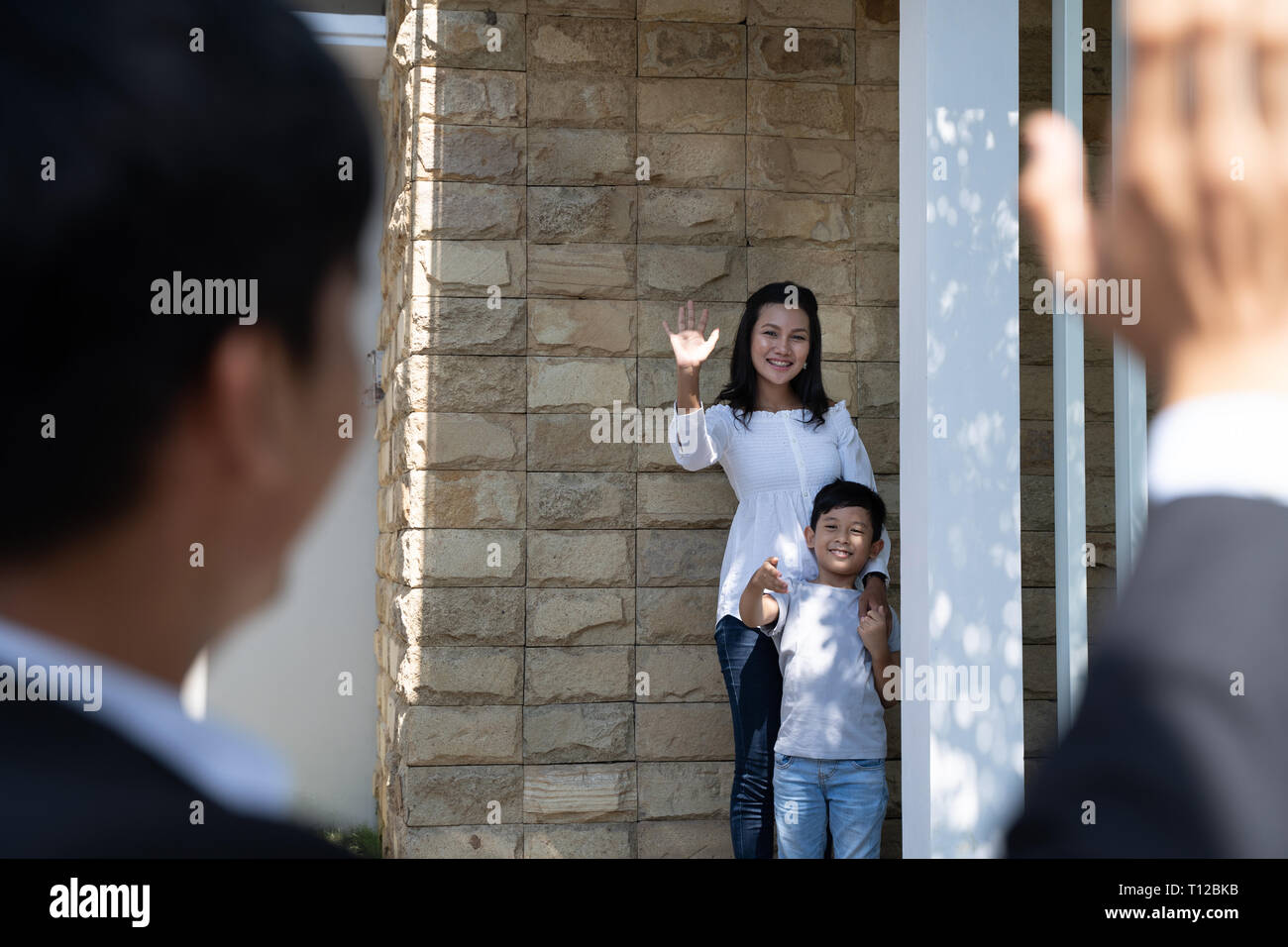 father waving goodbye to his family before going to work Stock Photo ...