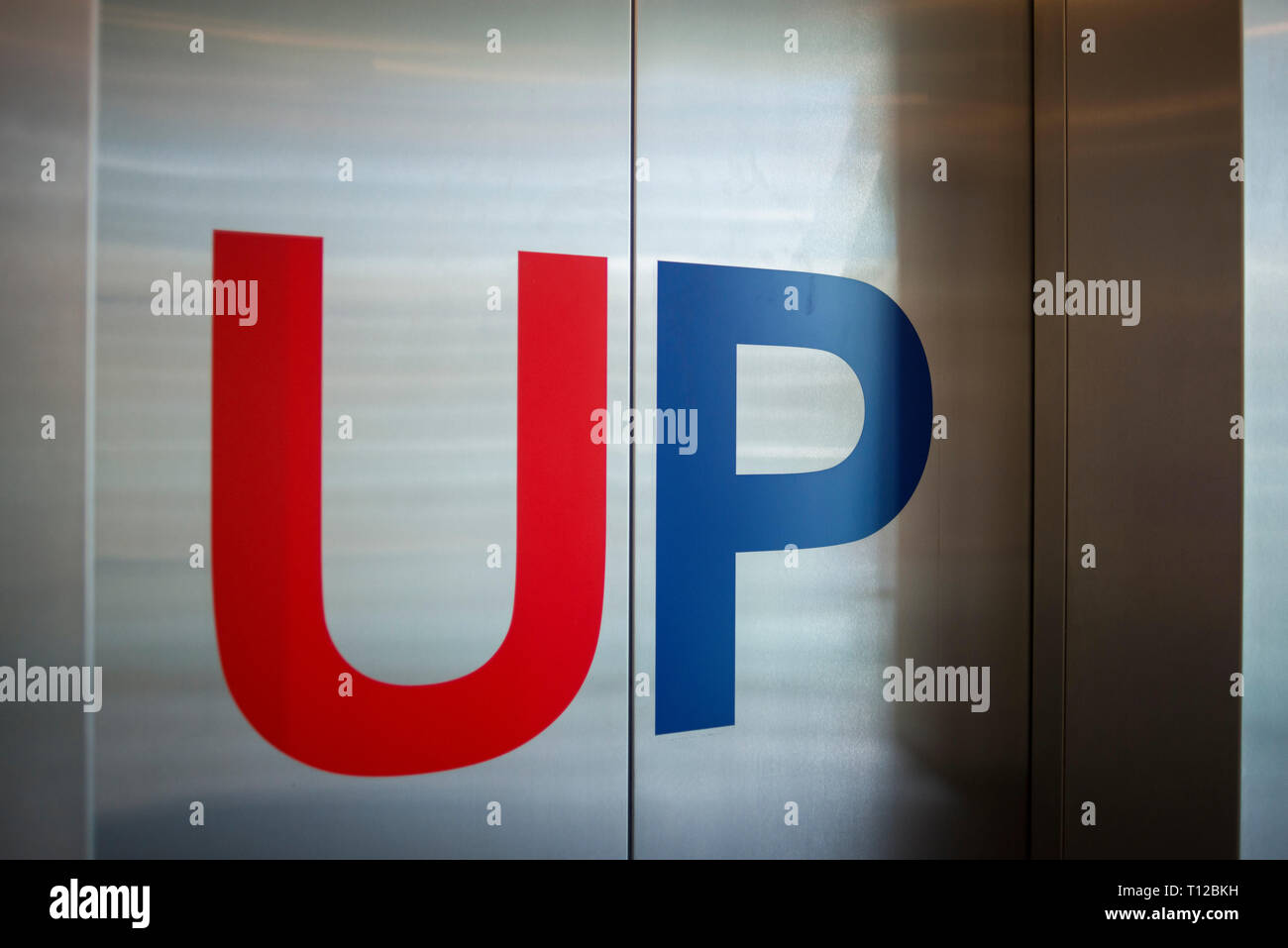 The word UP on lift / elevator doors Stock Photo - Alamy
