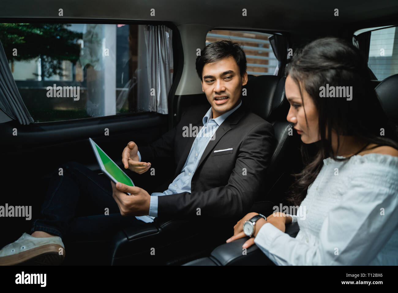 young business people meeting in the car Stock Photo - Alamy