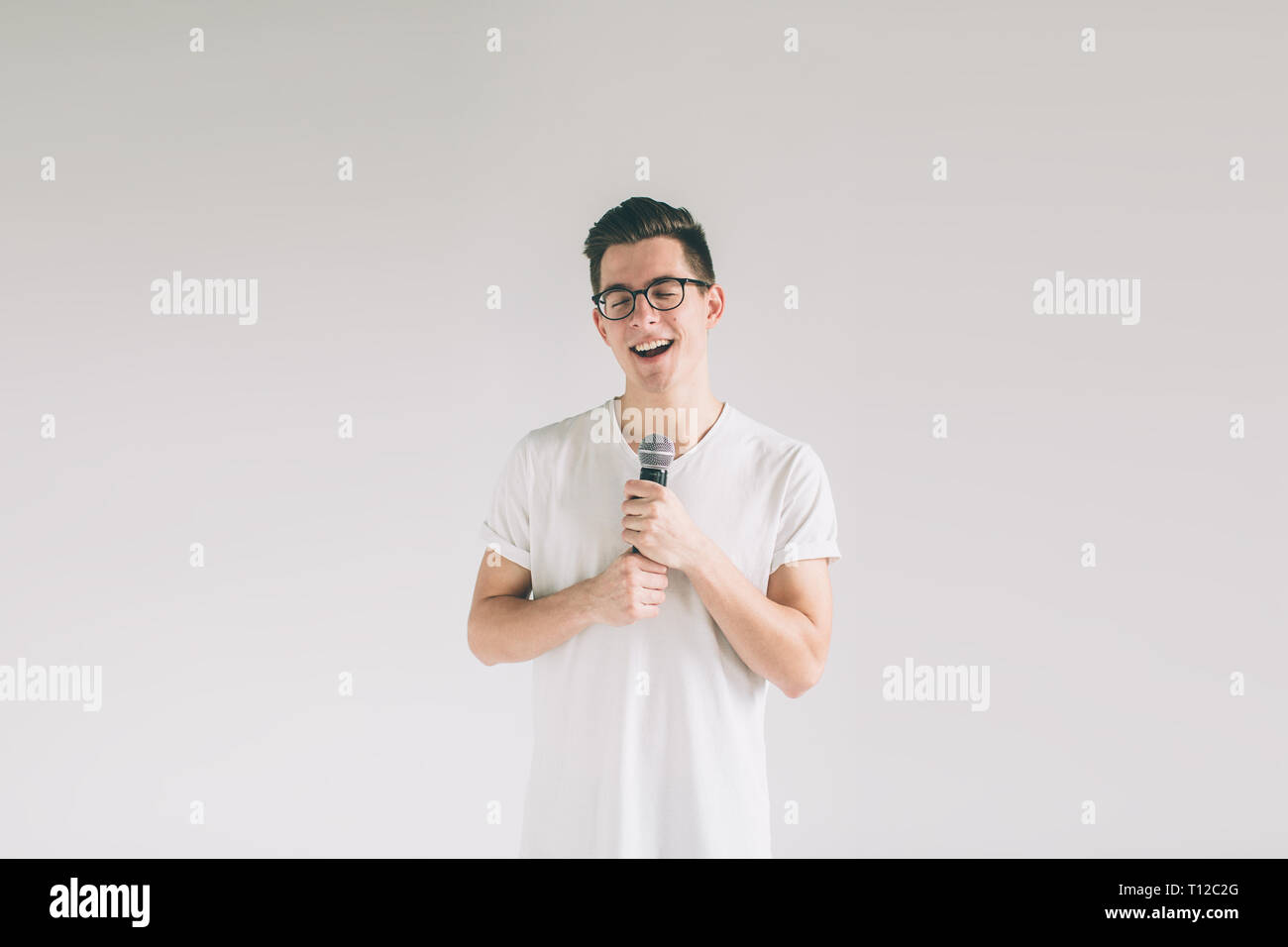 Boy Rocking Out. Image of a handsome man singing to the microphone ...