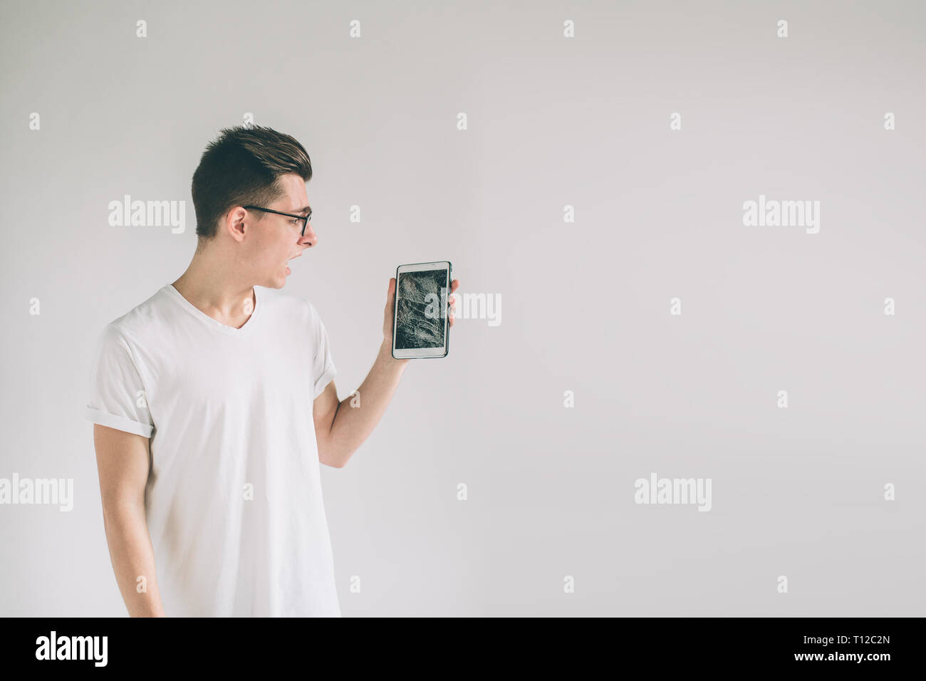 Man behind broken glass hi-res stock photography and images - Alamy