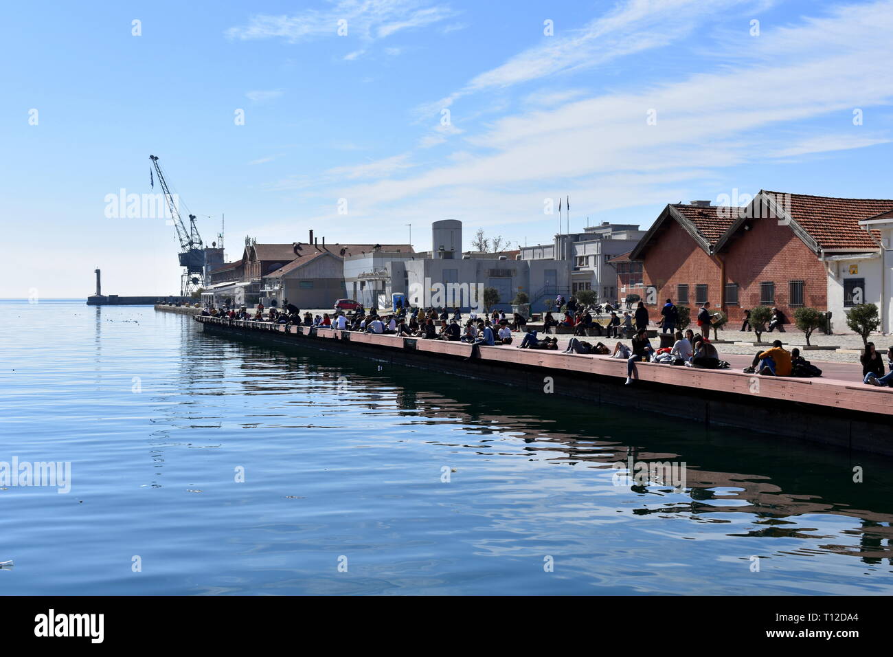 Youngsters hanging out on Thessaloniki port quayside, Thessaloniki ...