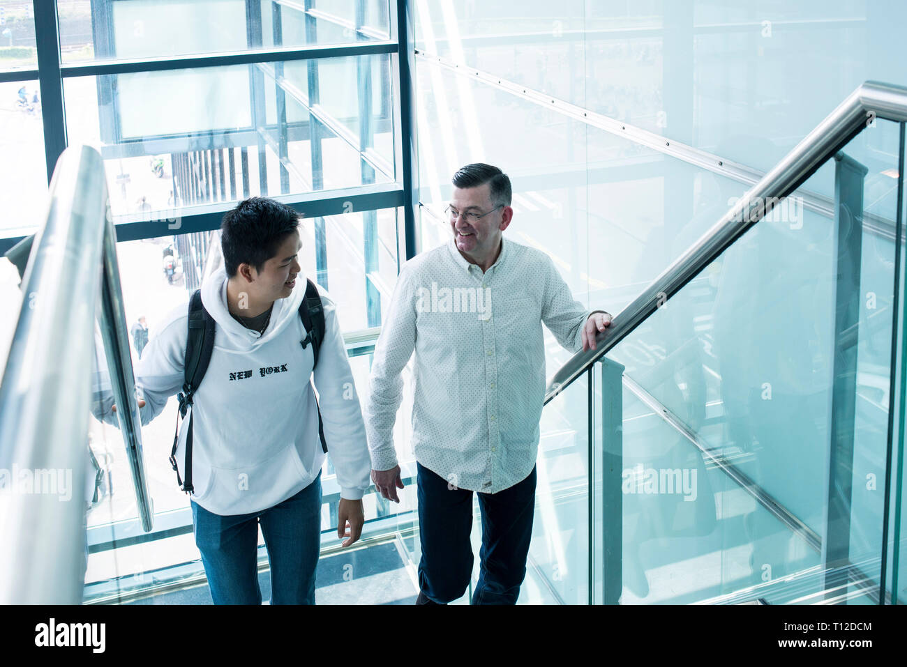 Students climbing stairs staircase hi-res stock photography and images ...