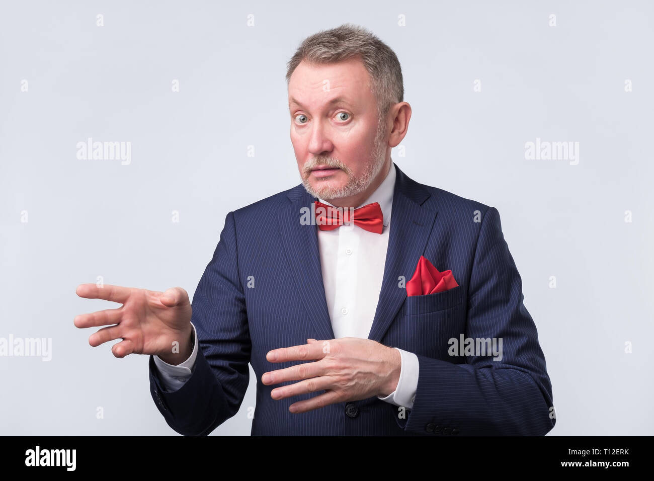 Old man standing explaining hi-res stock photography and images - Alamy