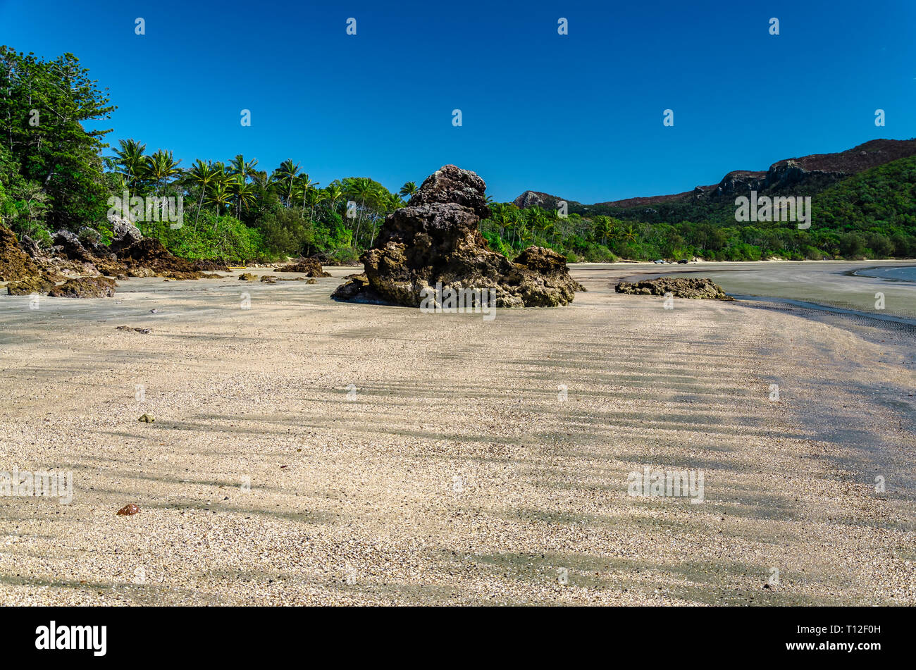 A rock formation on a beach in tropical Queensland Stock Photo - Alamy