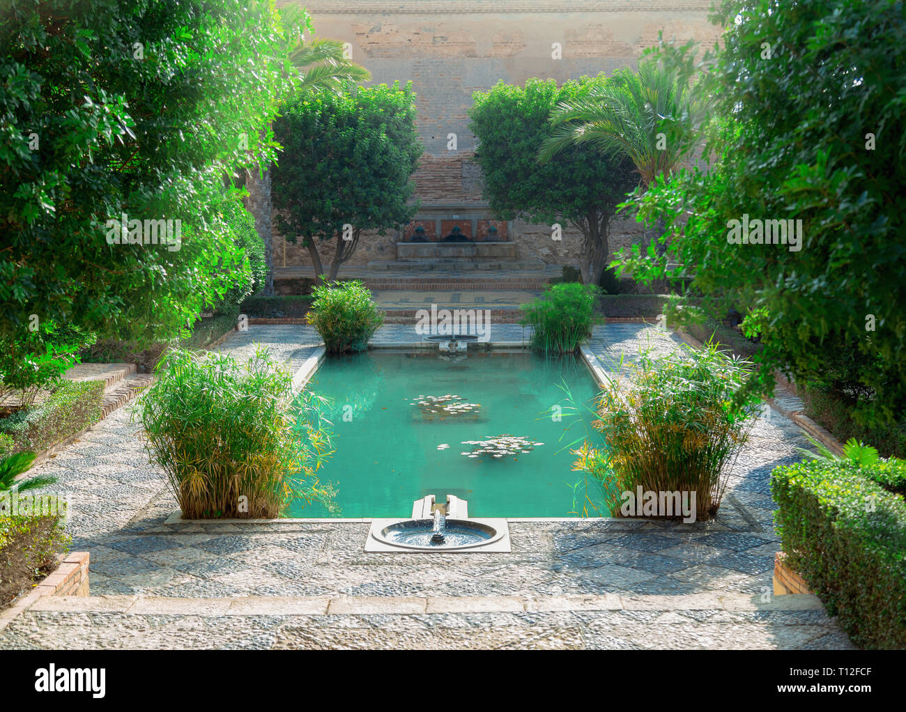 patio with fountain in a medieval castle Alcazaba, Spain Stock Photo ...