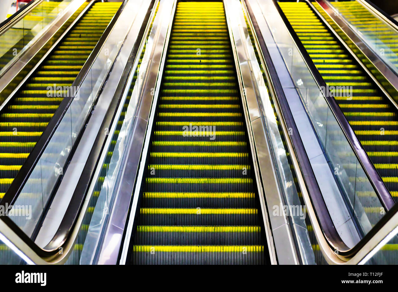 Yellow marked escalators in Budapest metro. Metro line 4 architecture ...