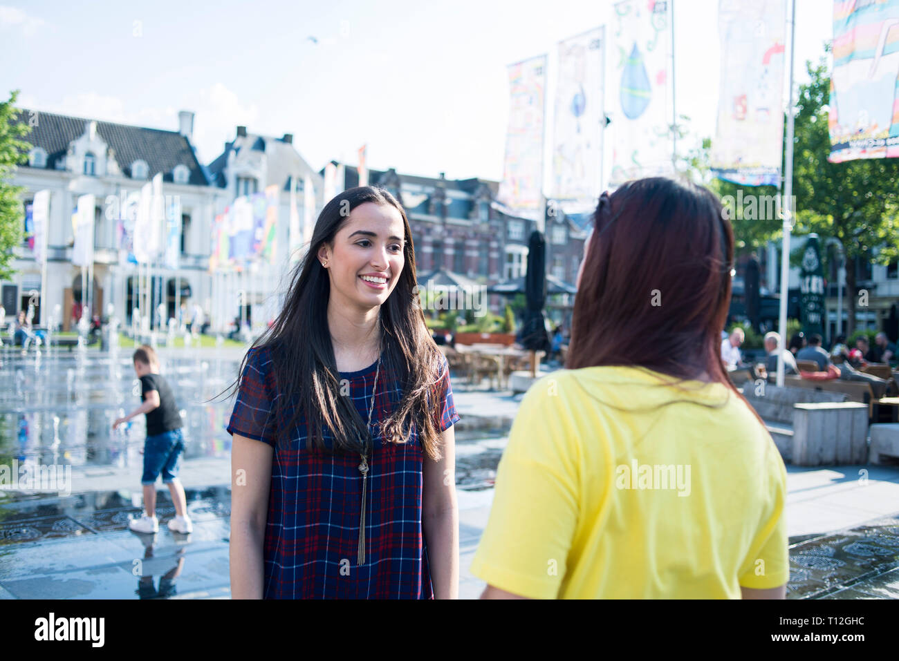 Two girls talking class hi-res stock photography and images - Alamy