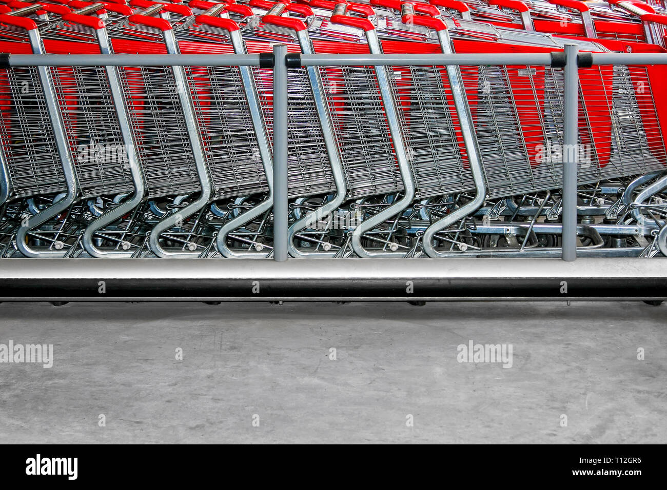 Bunch of shopping carts trolleys in line Stock Photo - Alamy
