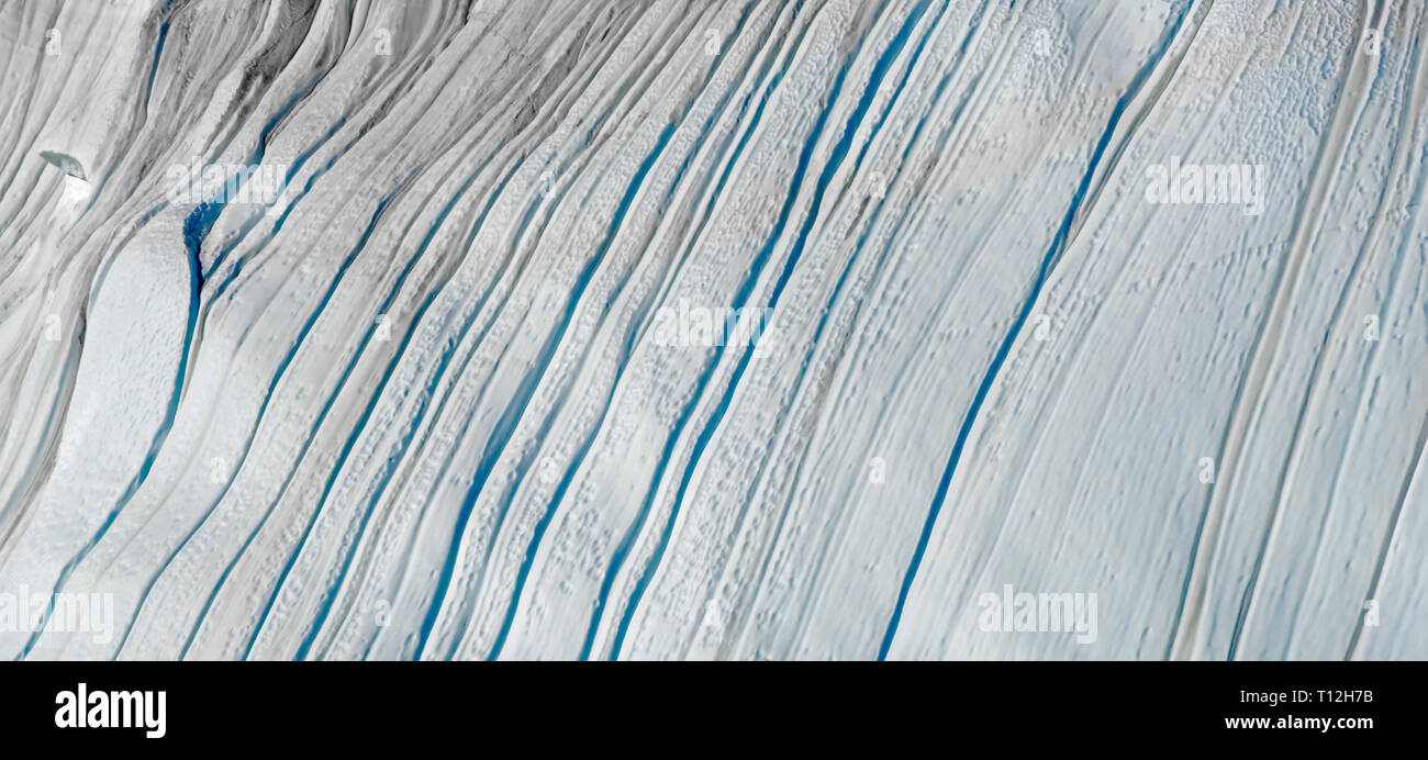 Eroded lines on icebergs of Sermermiut, Ilulissat, Greenland Stock ...