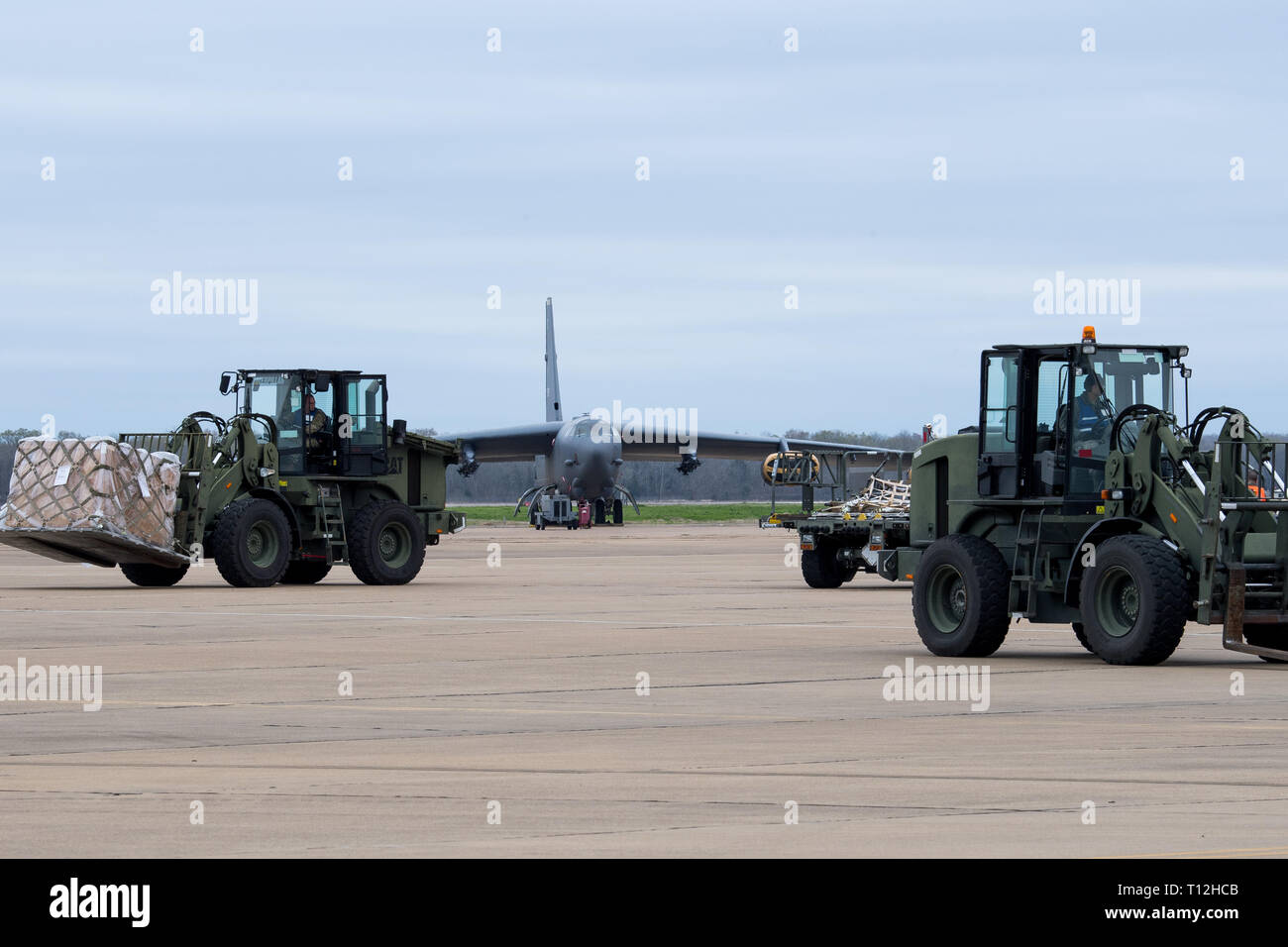 Members of the 2nd Logistics Readiness Squadron drive forklifts at ...