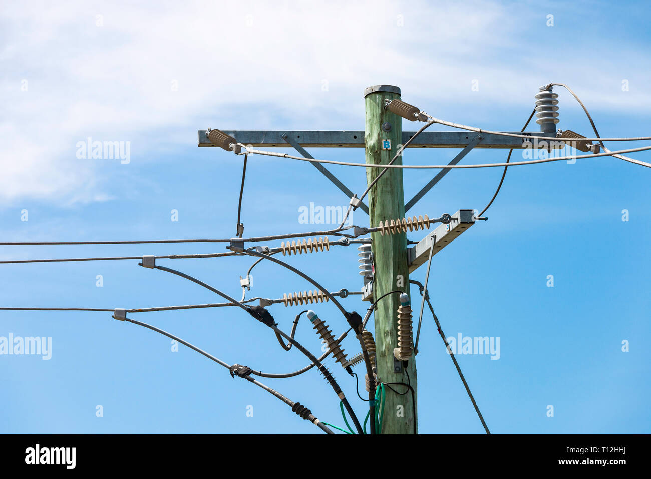 Power pole transforming electricity above street Stock Photo - Alamy
