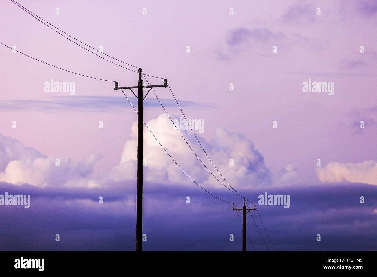 Telephone pylons stringing together during dramatic dusk sunset Stock ...