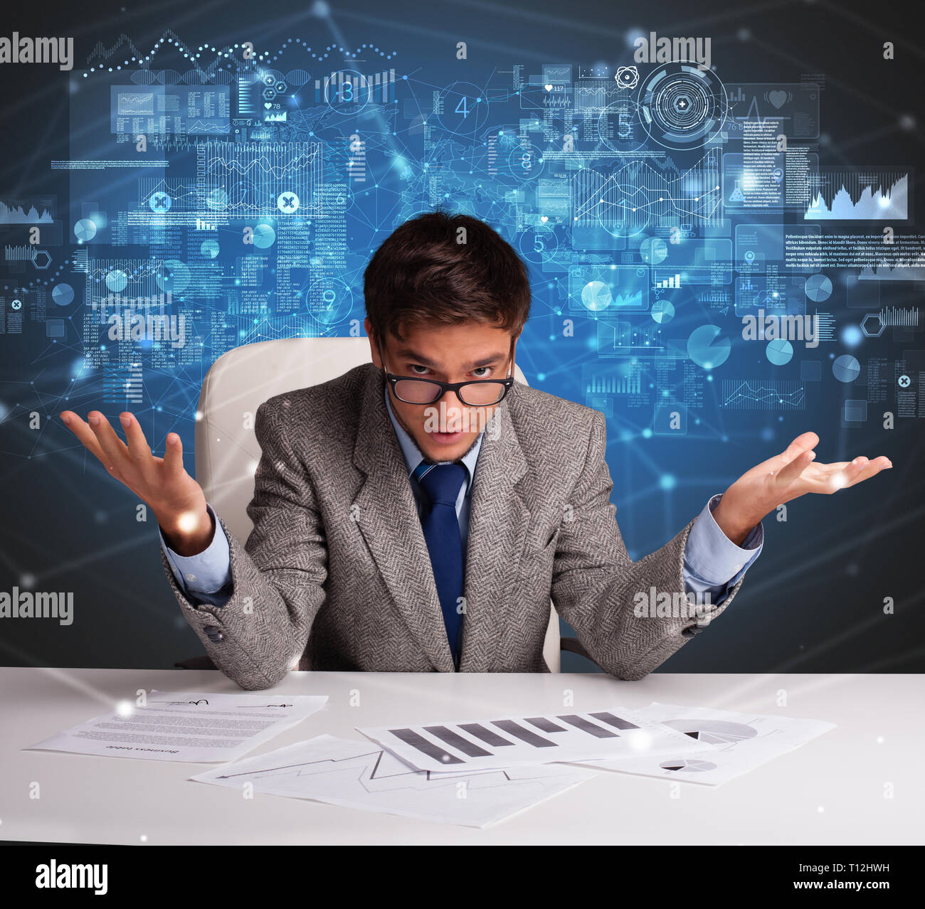 Young manager at the office making report and statistics Stock Photo ...