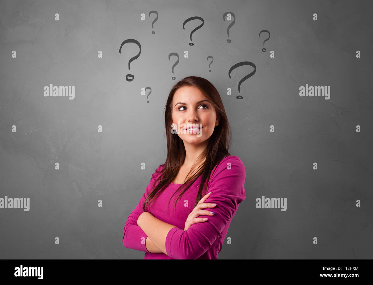 Person with question marks around face Stock Photo - Alamy