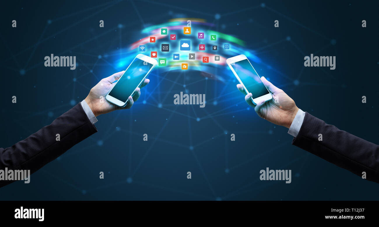 Two mobile phones syncing applications concept Stock Photo - Alamy
