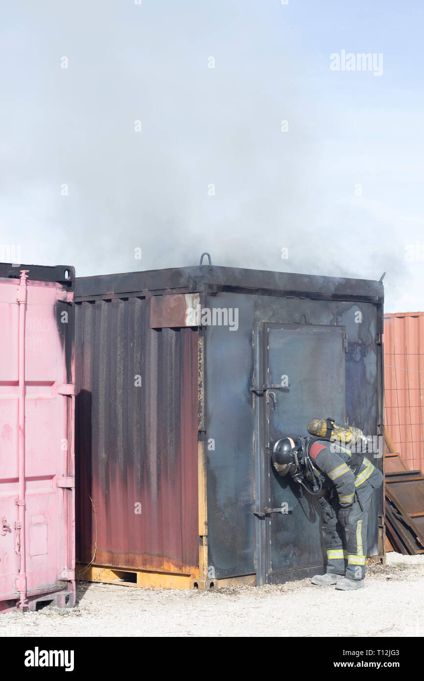 Firefighter putting out fire training station extinguisher backdraft ...