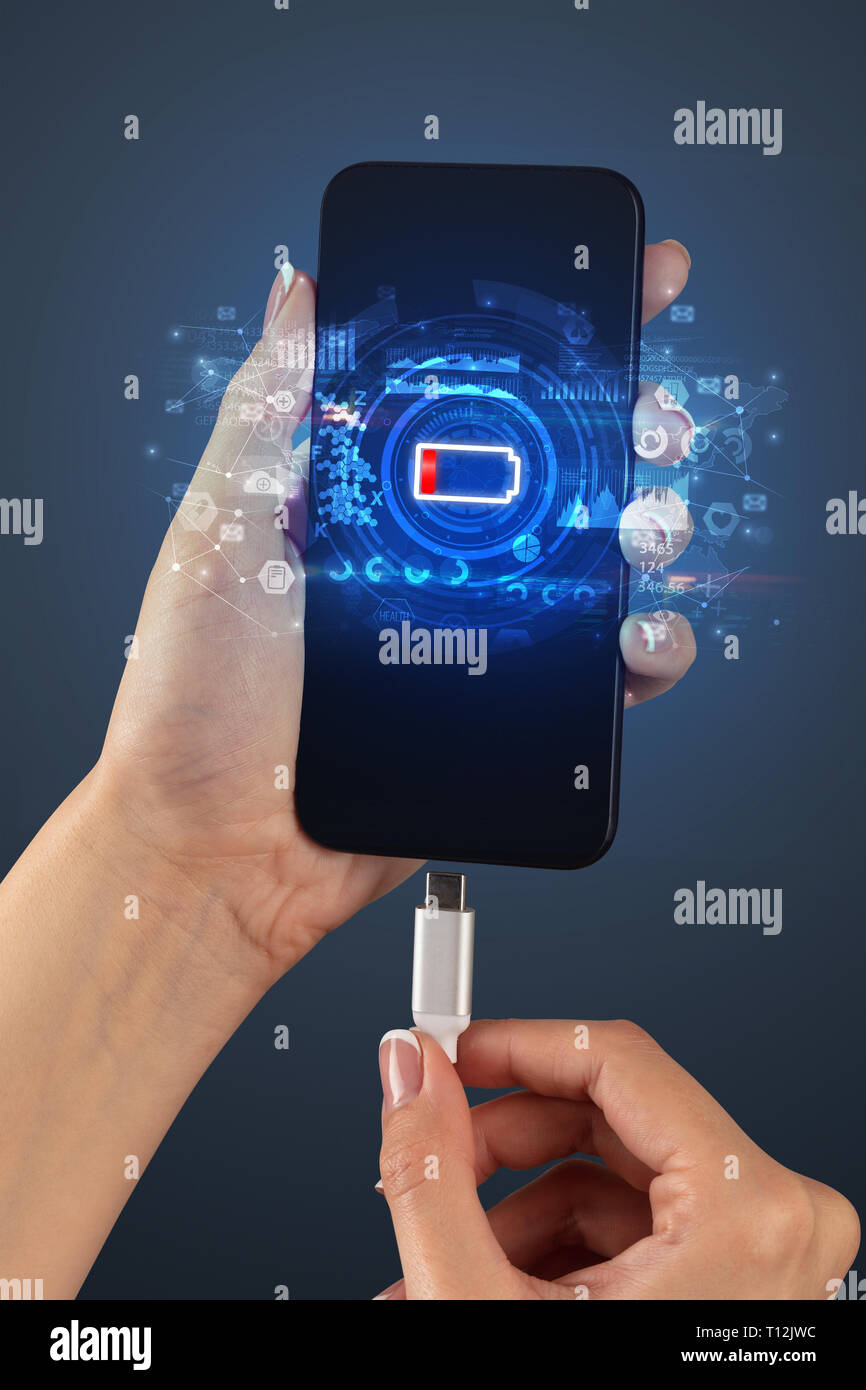 Elegant hand charging smartphone with global report concept Stock Photo ...