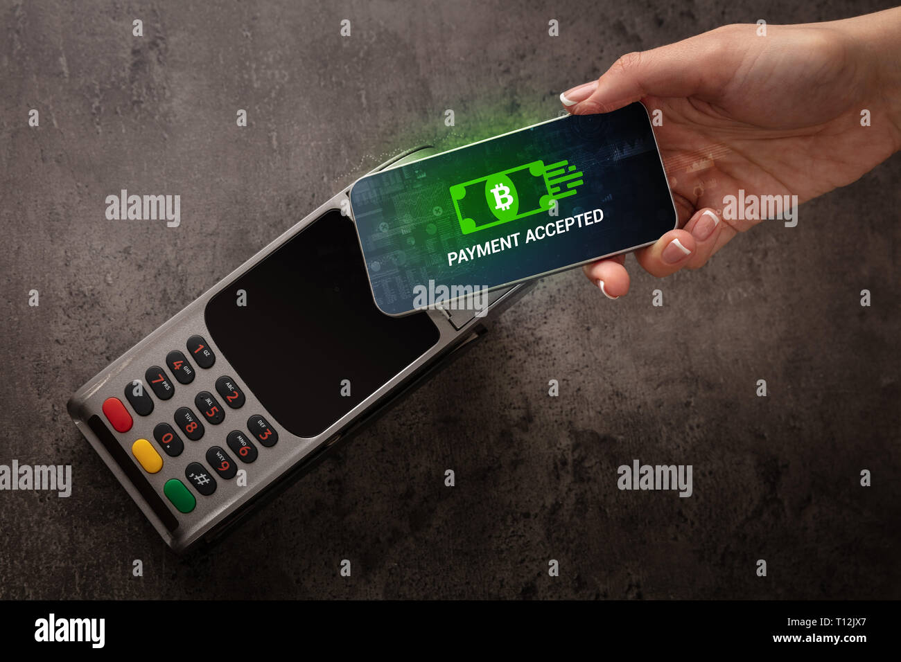 Hand paying with digital currency from smartphone Stock Photo - Alamy