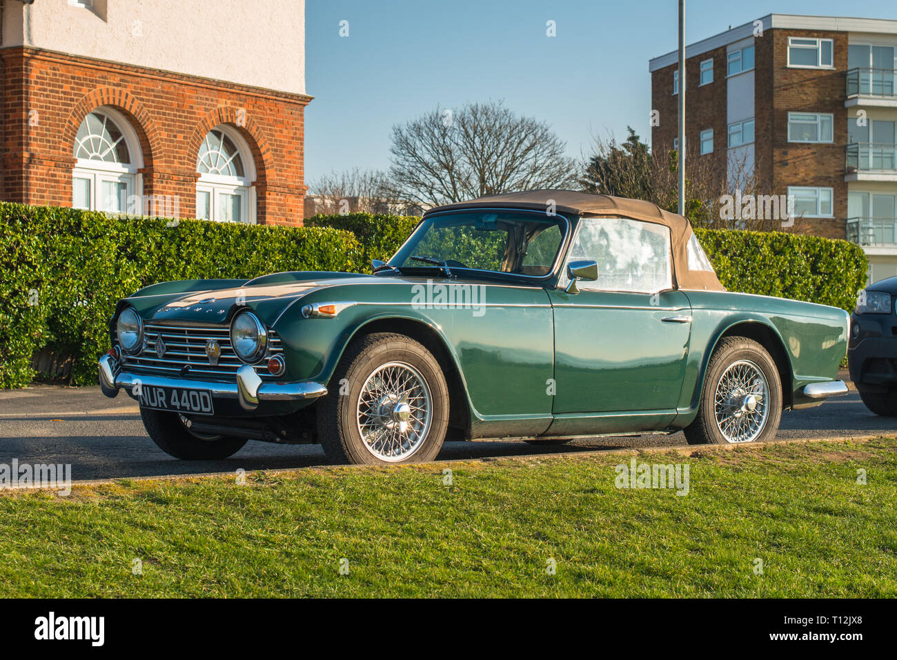 Classic Triumph TR4 convertible sports car in racing green parked near ...