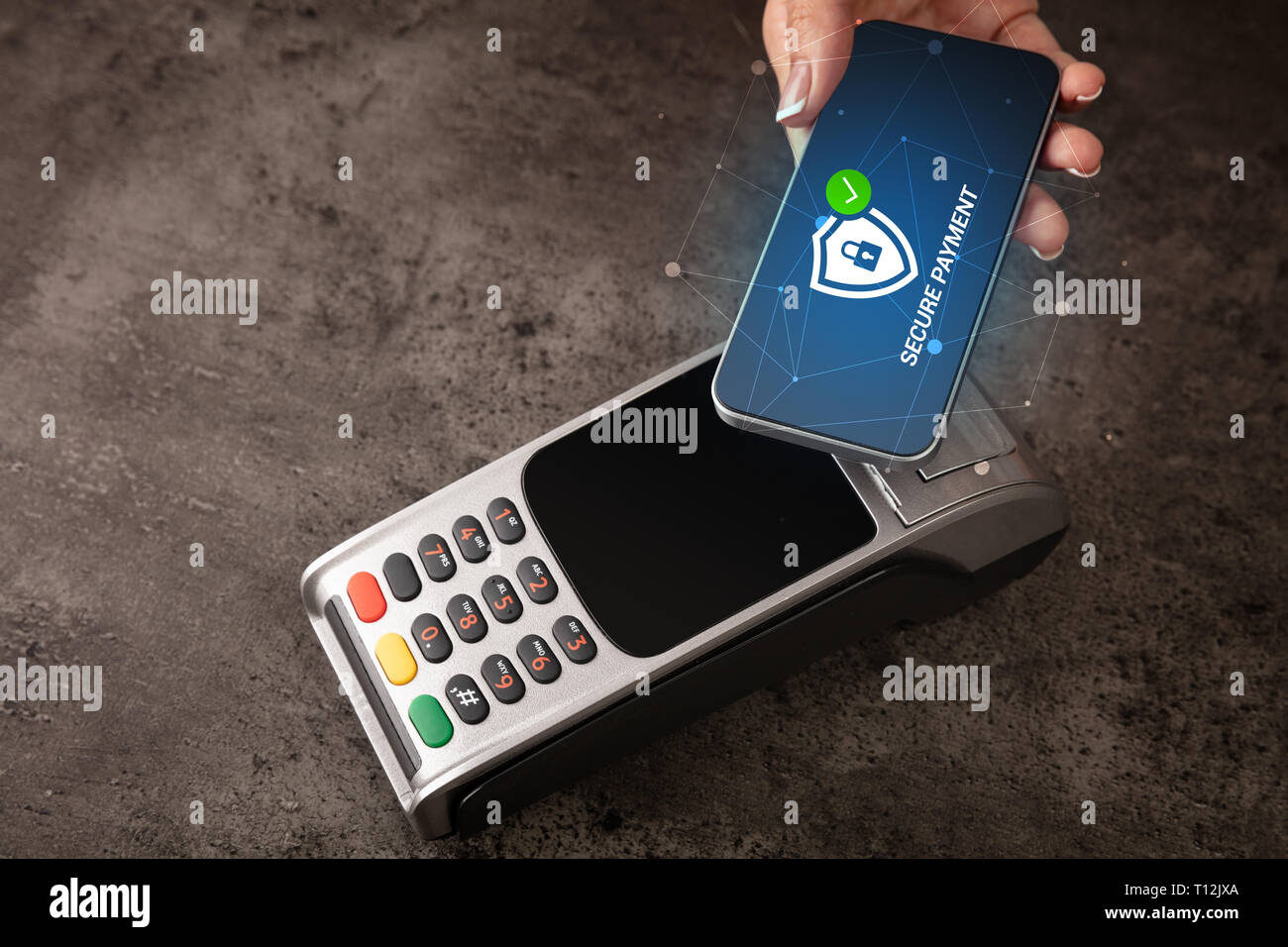 Hand paying on terminal with smartphone in secure payment system Stock ...
