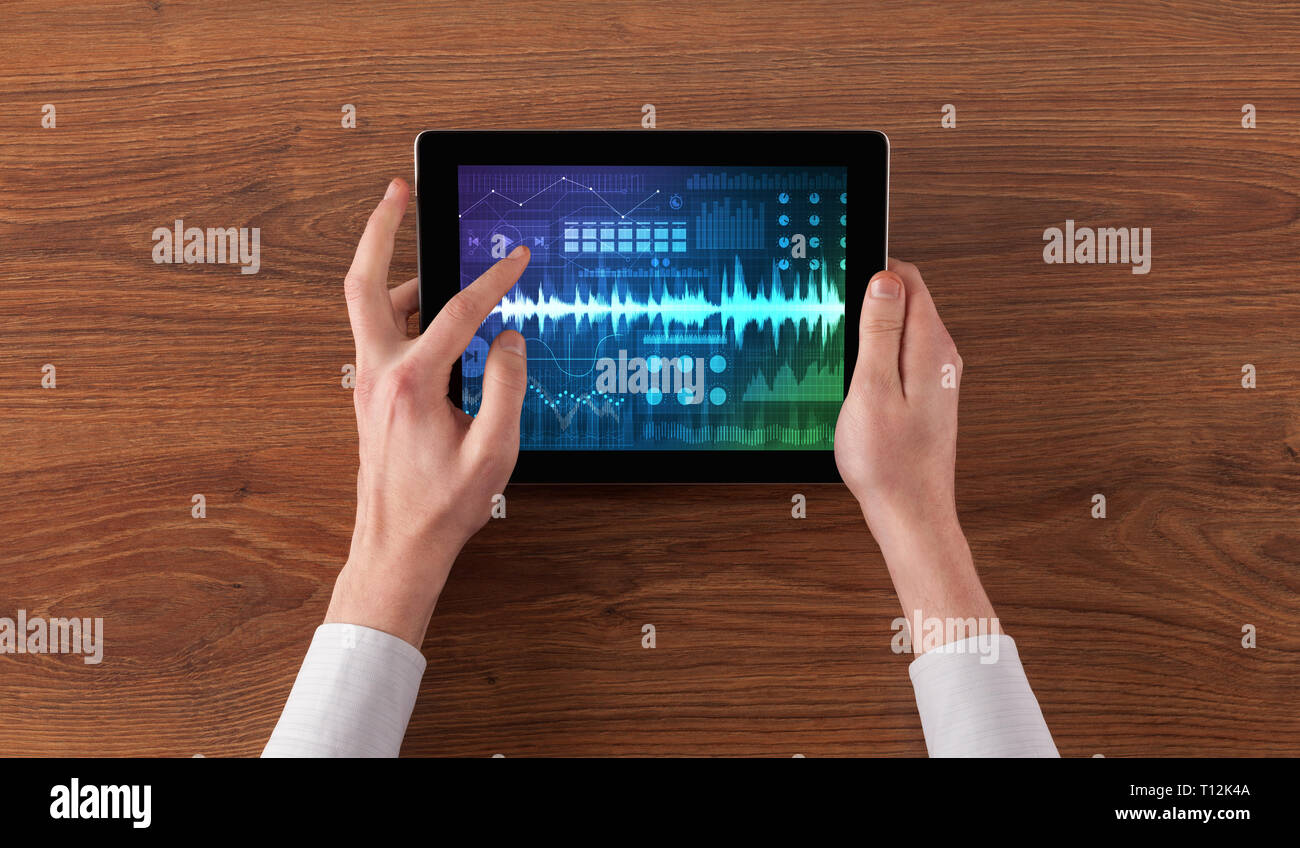 Hand touching tablet with waveforms and sound design concept Stock ...