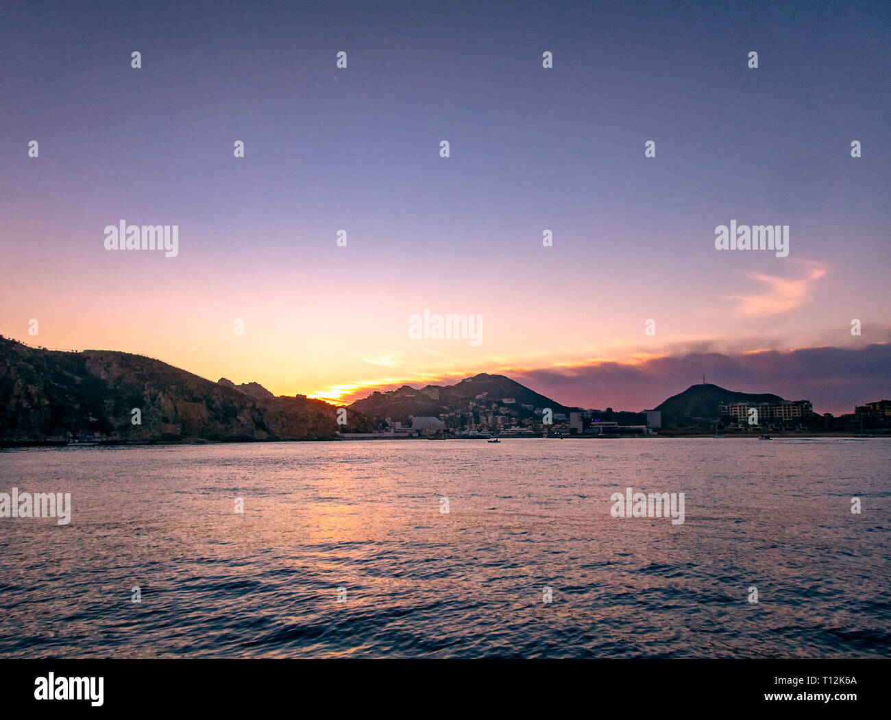The colours of a Pacific sunset over the resort of Cabo San Lucas in ...