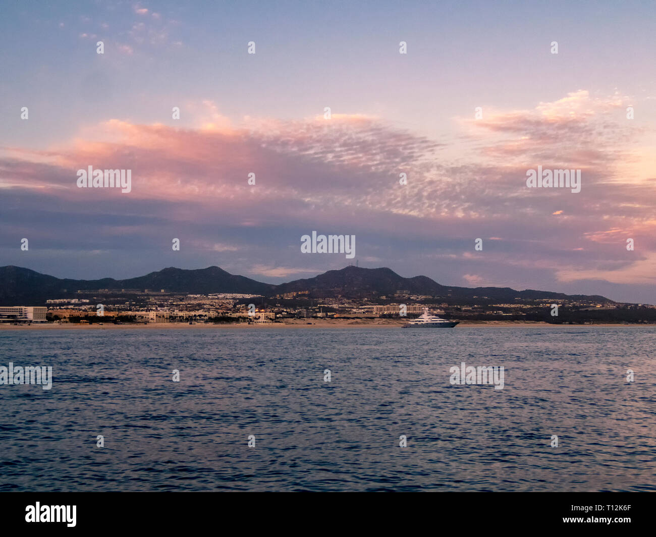 The colours of a Pacific sunset over the resort of Cabo San Lucas in ...