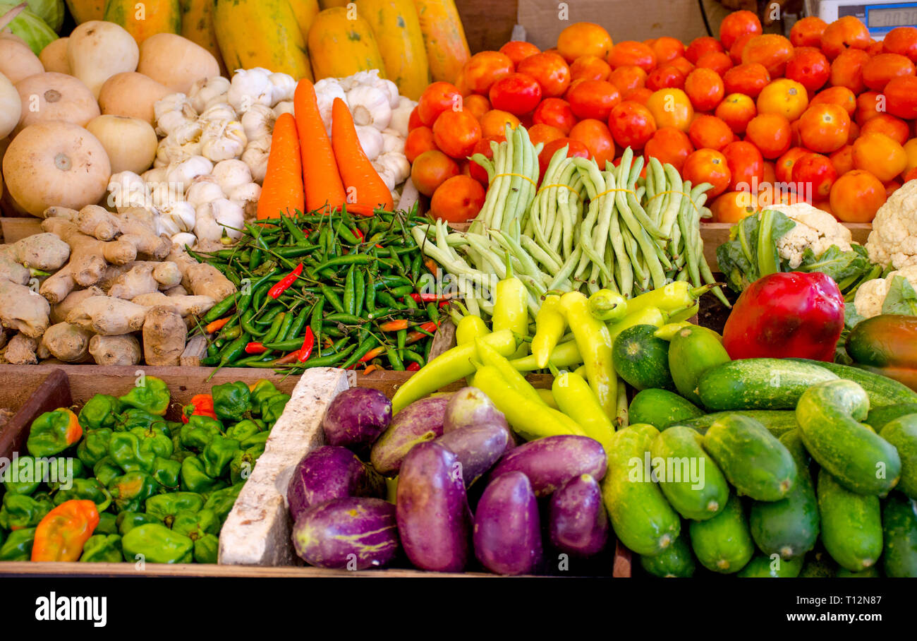 fresh vegetables on a market counter Stock Photo - Alamy