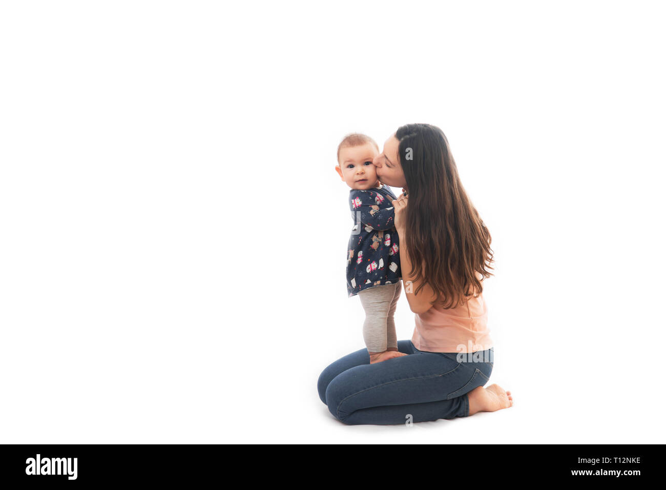 A mother and baby bonding together isolated on white background Stock ...