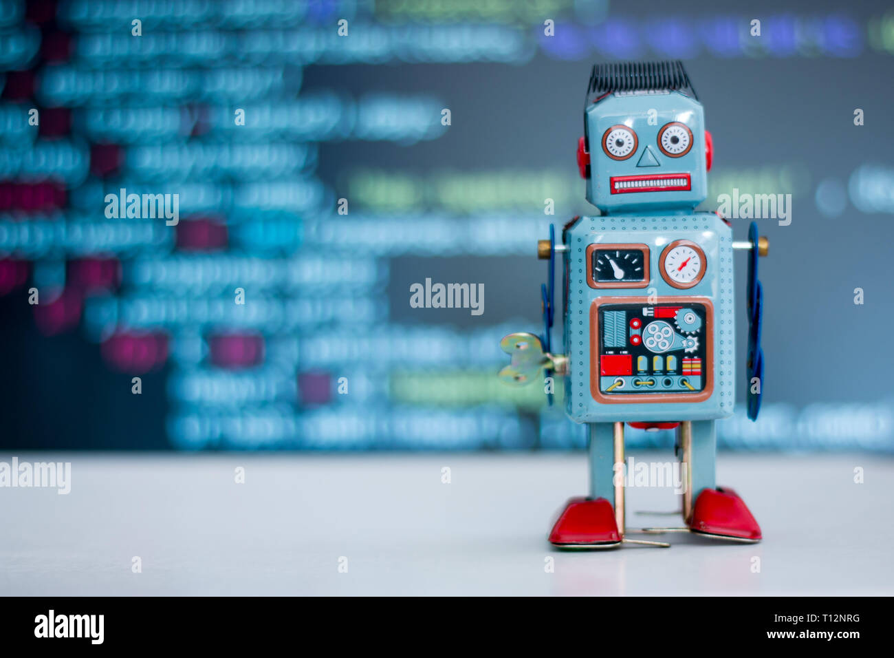 Symbol for a chatbot or social bot and algorithms, program code in the ...