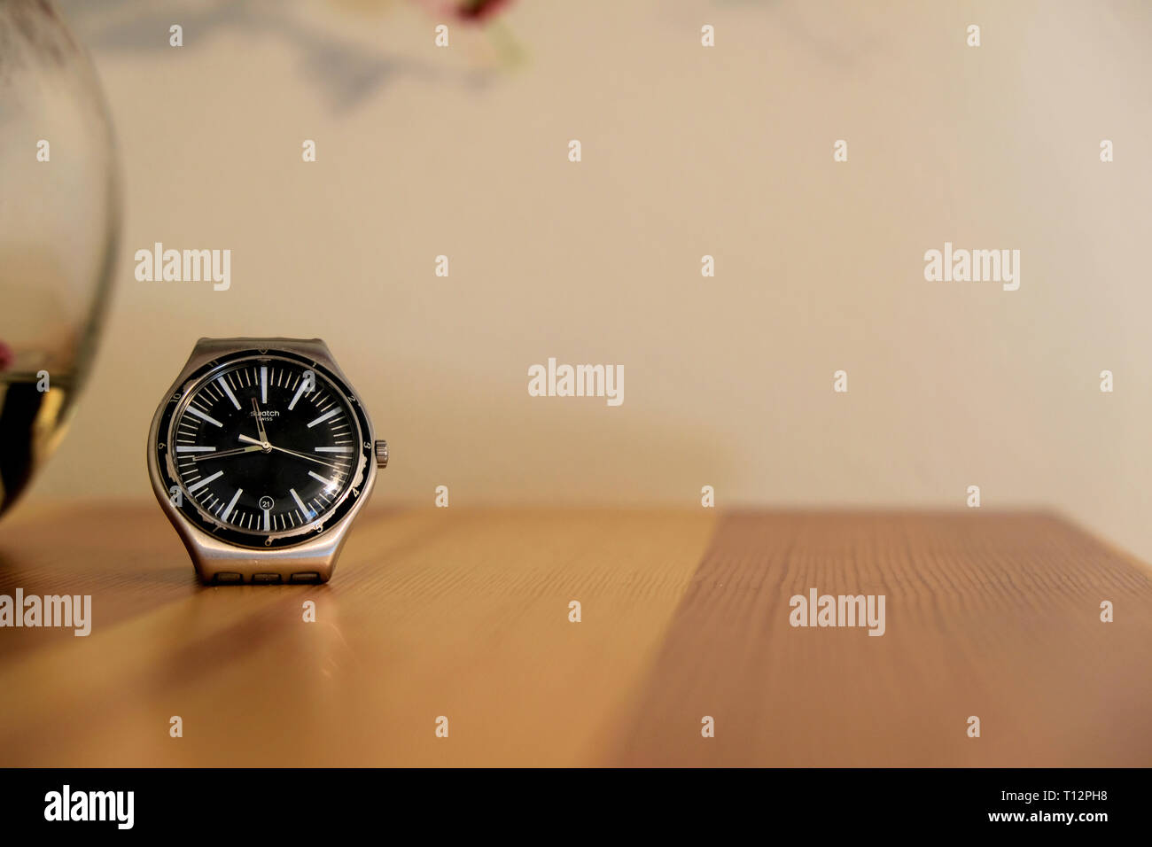 Wrist watch on wooden counter top; concept or order and time Stock ...
