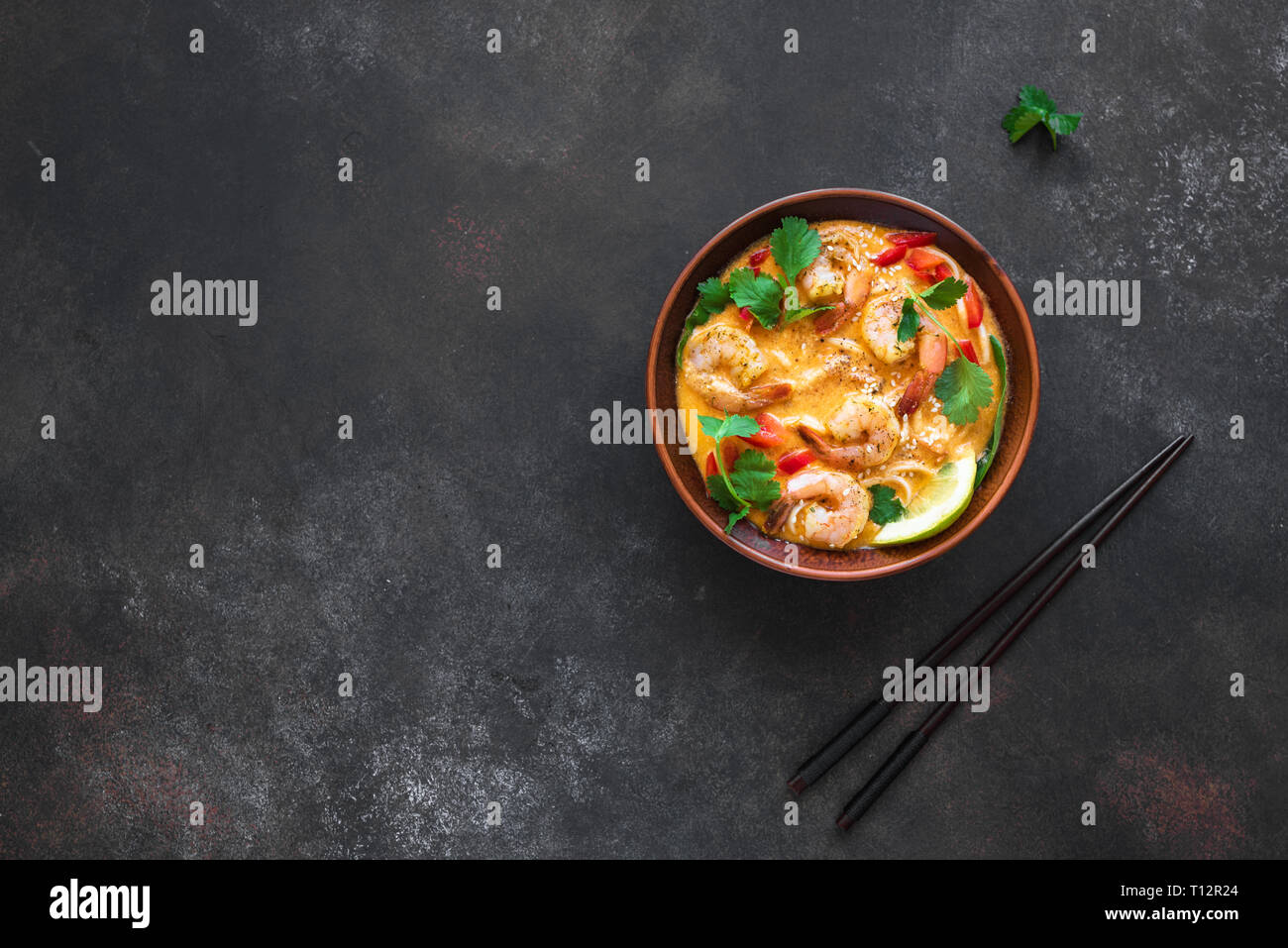 Laksa Shrimp Soup. Prawn noodle laksa soup on black background, top ...