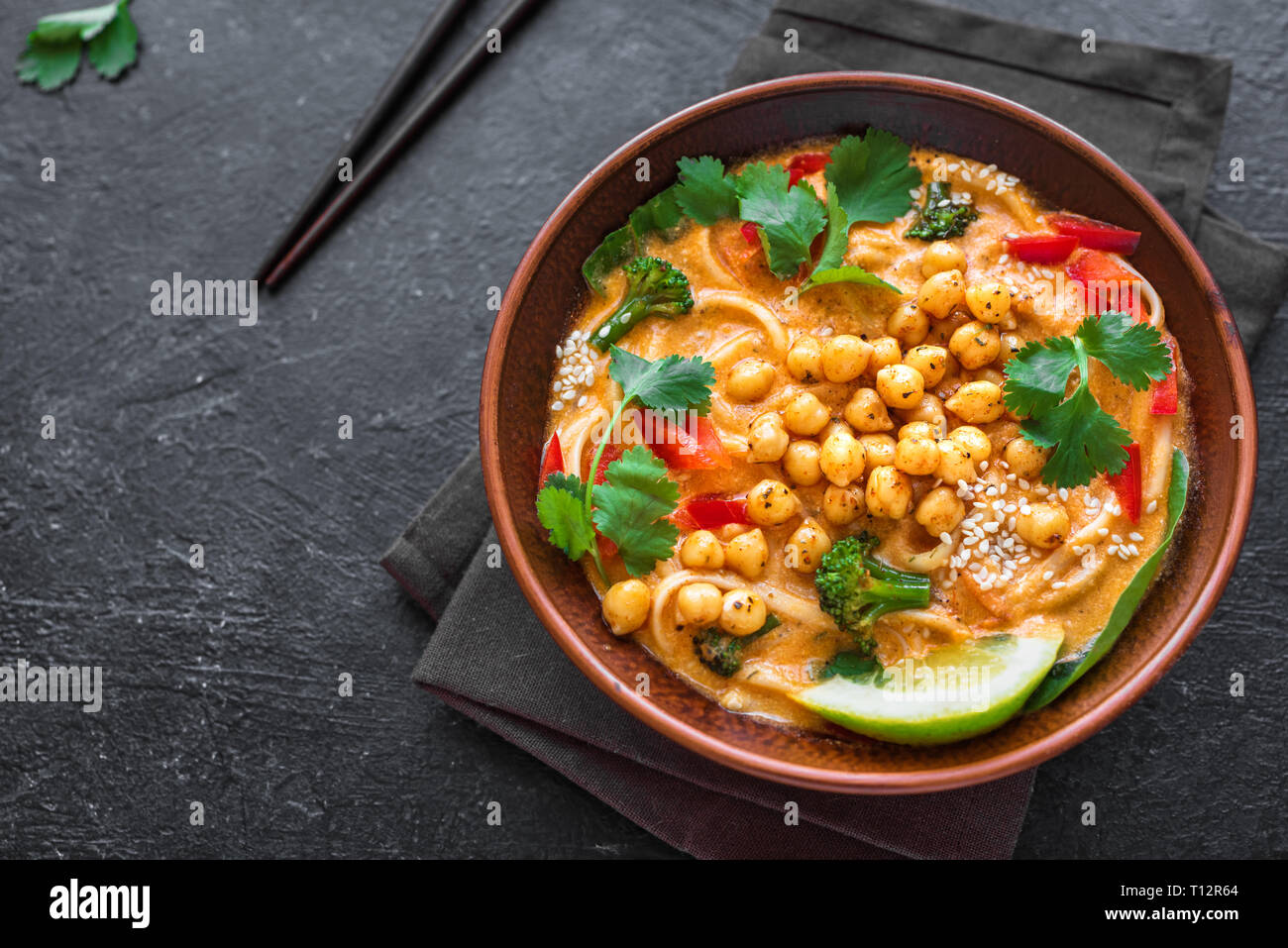 Laksa Soup. Vegetable noodle laksa soup on black background, copy space ...