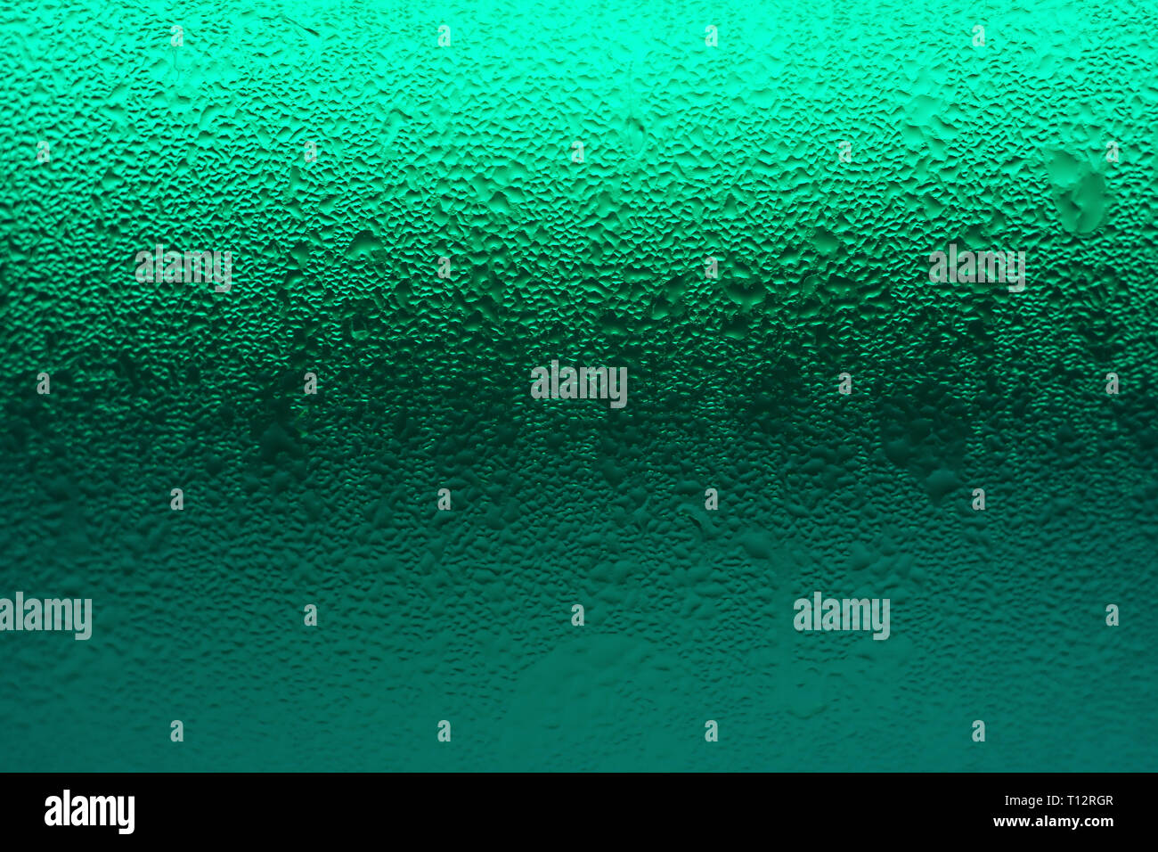 Green color gradation of beverage glass with condensation for texture ...