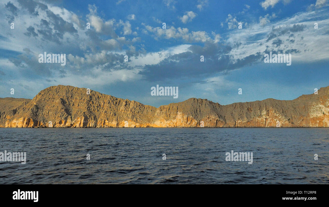Beautiful mountains reflected in the water. Fjords on the Musandam ...