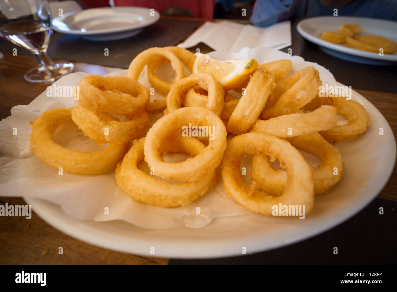 Spanish tapas: Plate of Roman-style squid or fried calamari with lemon ...