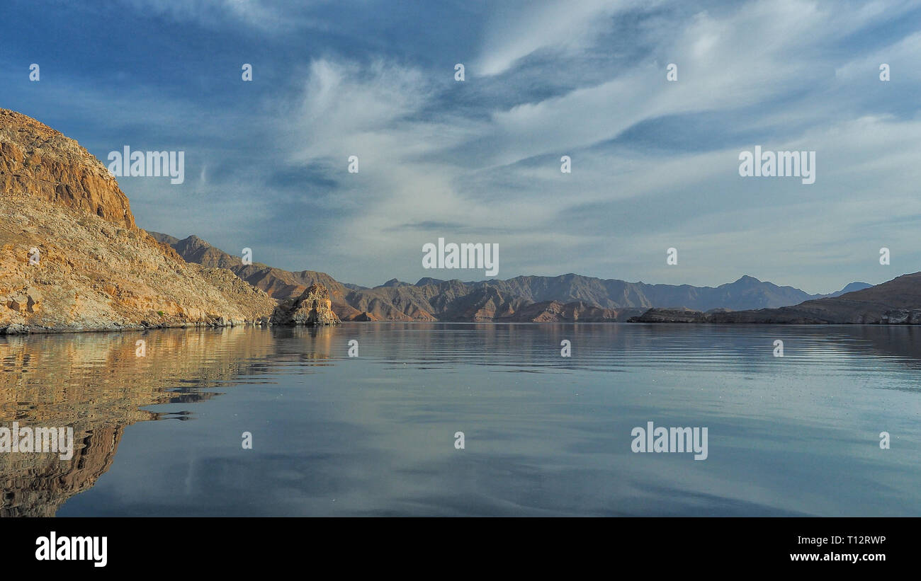 Beautiful mountains reflected in the water. Fjords on the Musandam ...