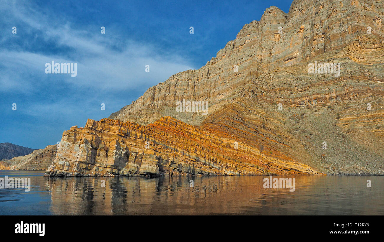 Beautiful mountains reflected in the water. Fjords on the Musandam ...