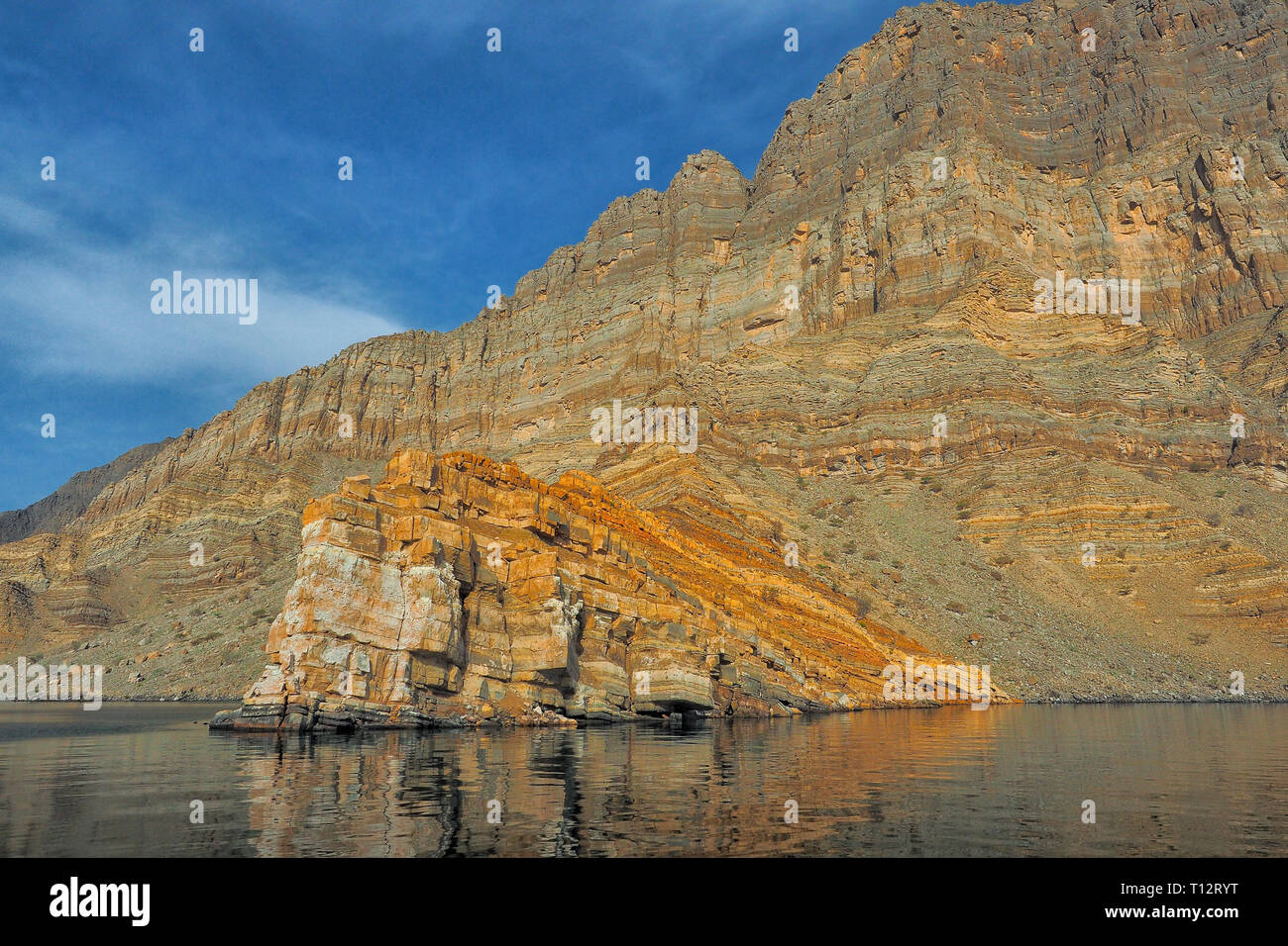 Beautiful mountains reflected in the water. Fjords on the Musandam ...