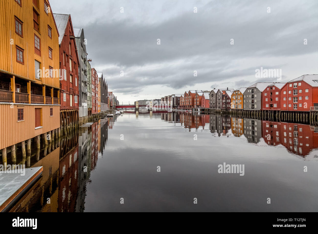 Colourful wooden buildings on the edge of river channels in the town of ...