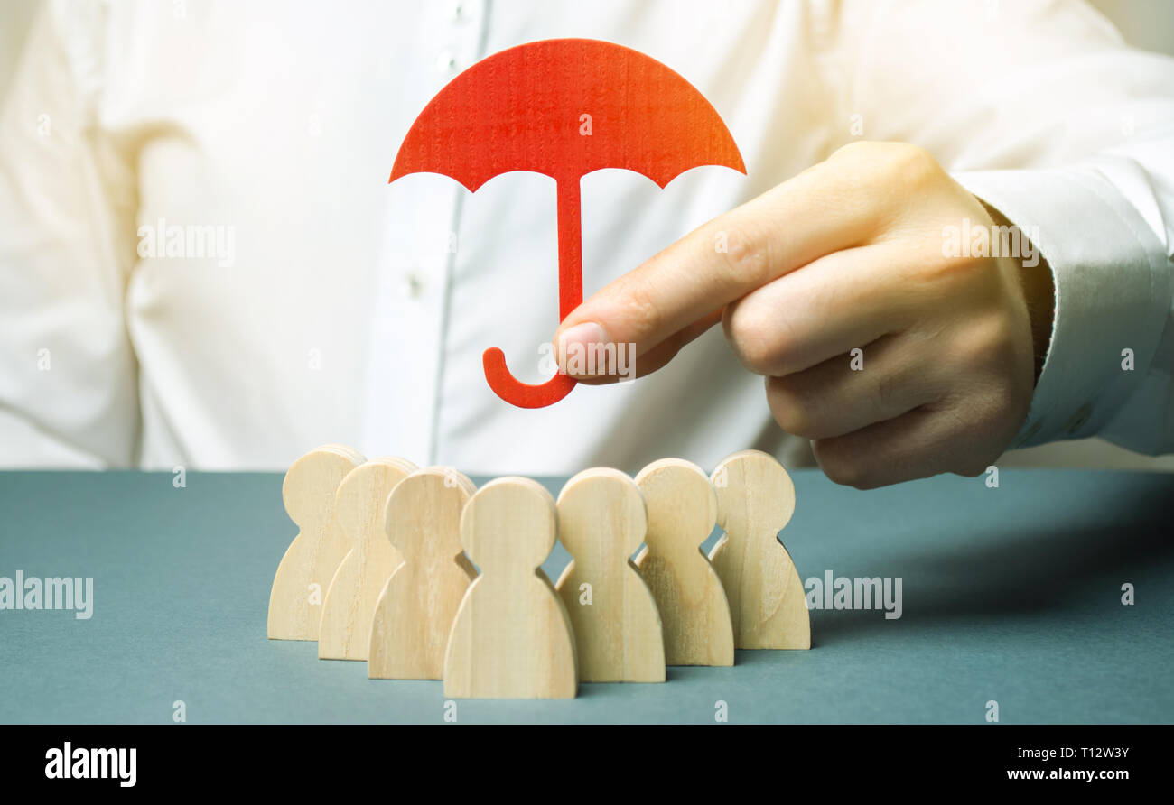 Boss holding a red umbrella and defending his team with a gesture of ...