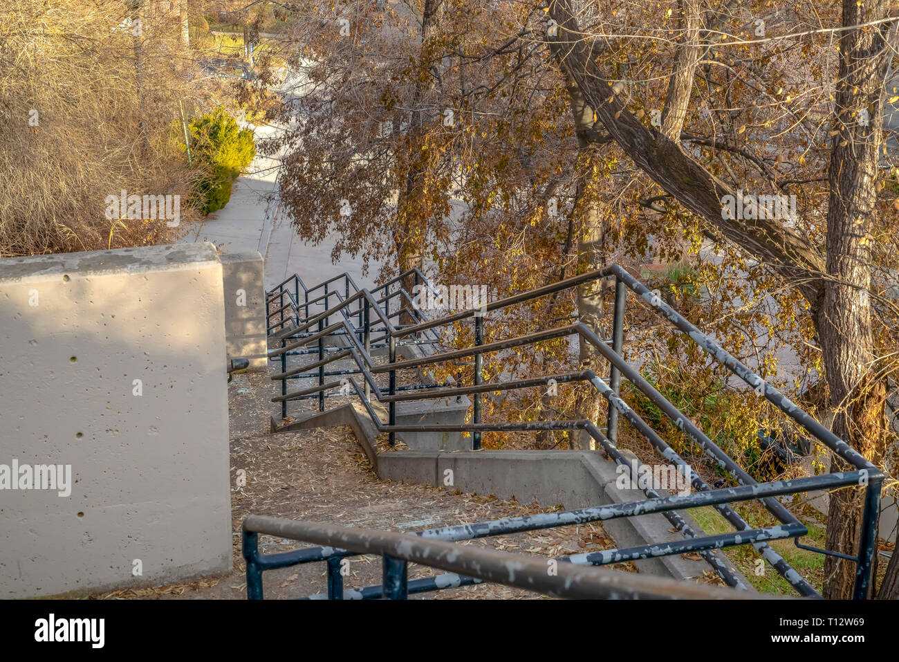 Outdoor staircase with weathered handrail in Utah. An outdoor staircase ...