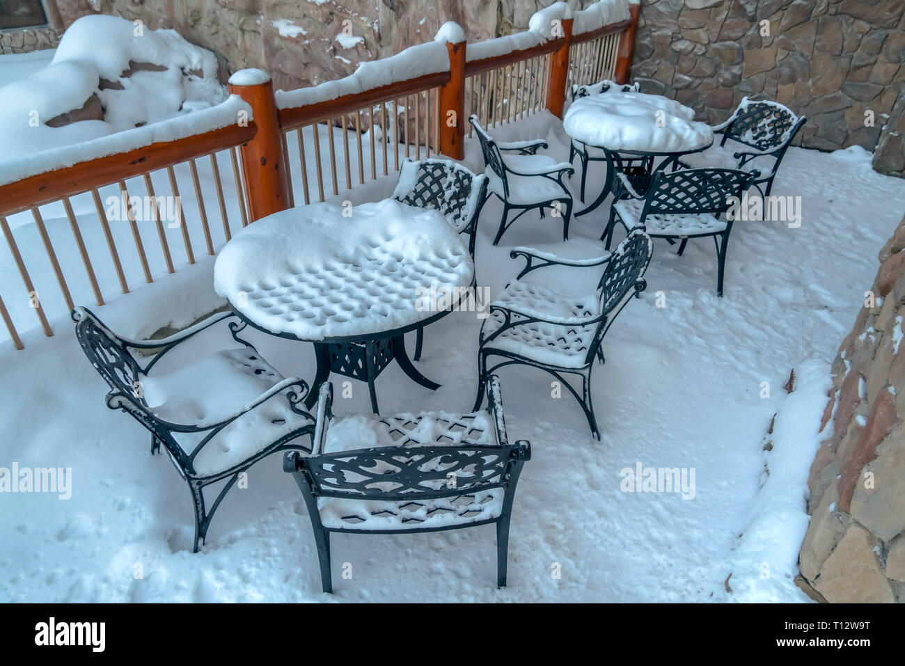Porch with furniture covered in snow in Park City. Snowy winter view of ...