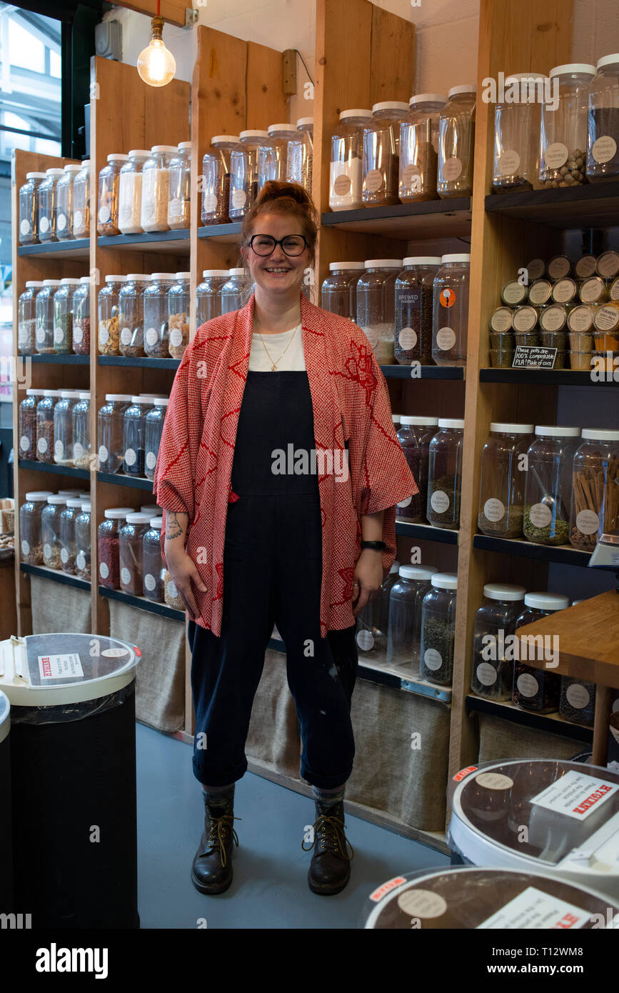 a female small business owner stands in their retail shop Stock Photo ...