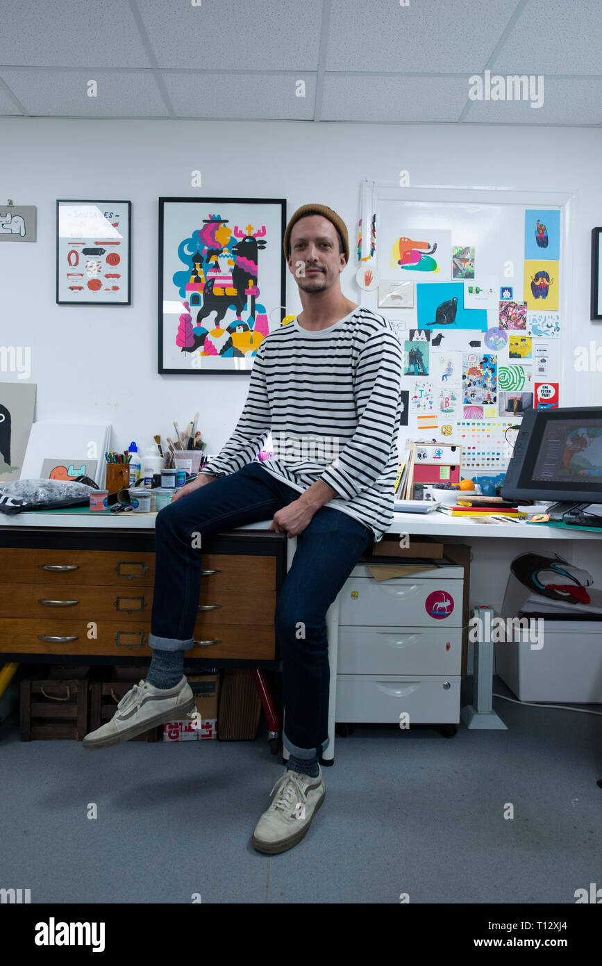 A creative artistic illustrator photographed in their interesting ...