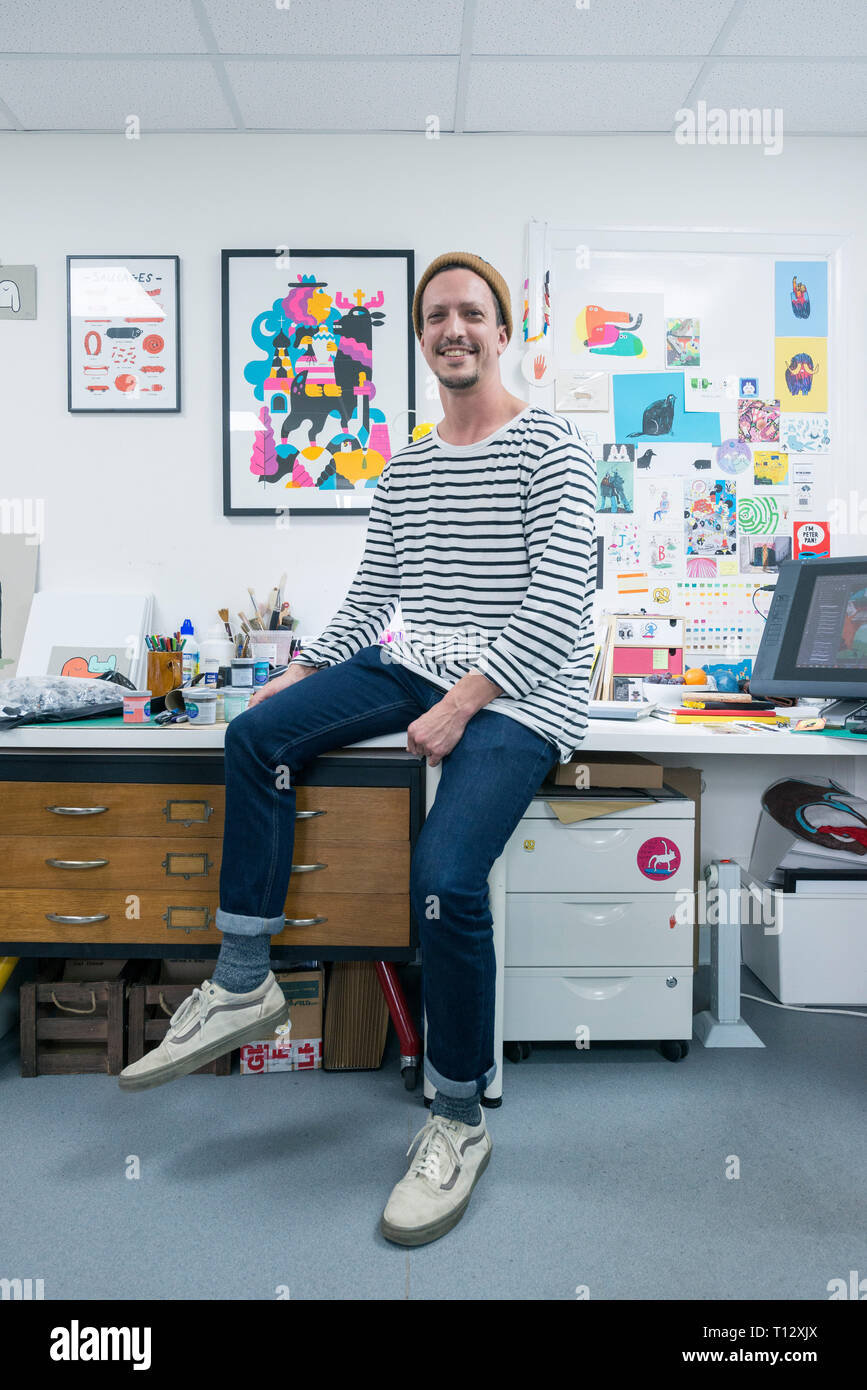 A creative artistic illustrator photographed in their interesting ...