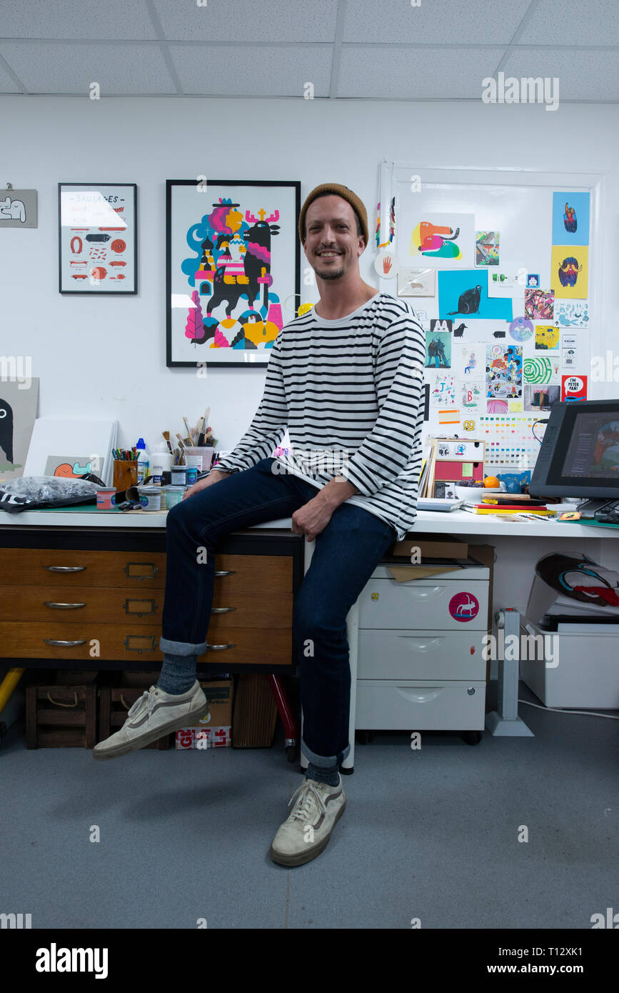 A creative artistic illustrator photographed in their interesting ...