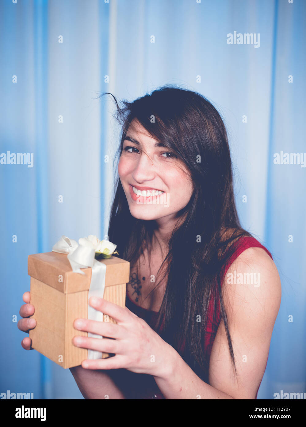 Woman holding object both hands hi-res stock photography and images - Alamy