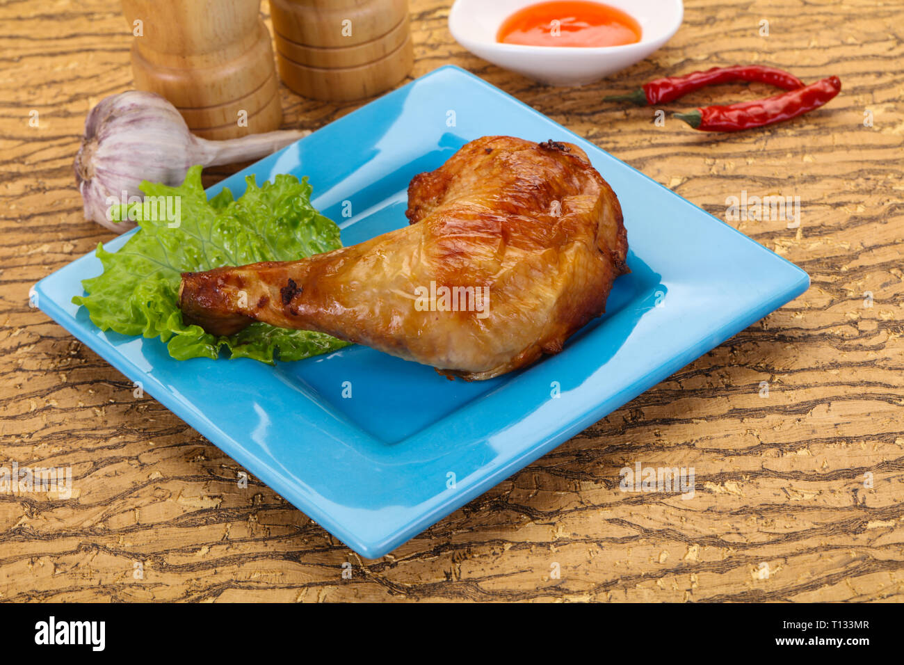 Crispy tasty Roasted chicken leg Stock Photo - Alamy